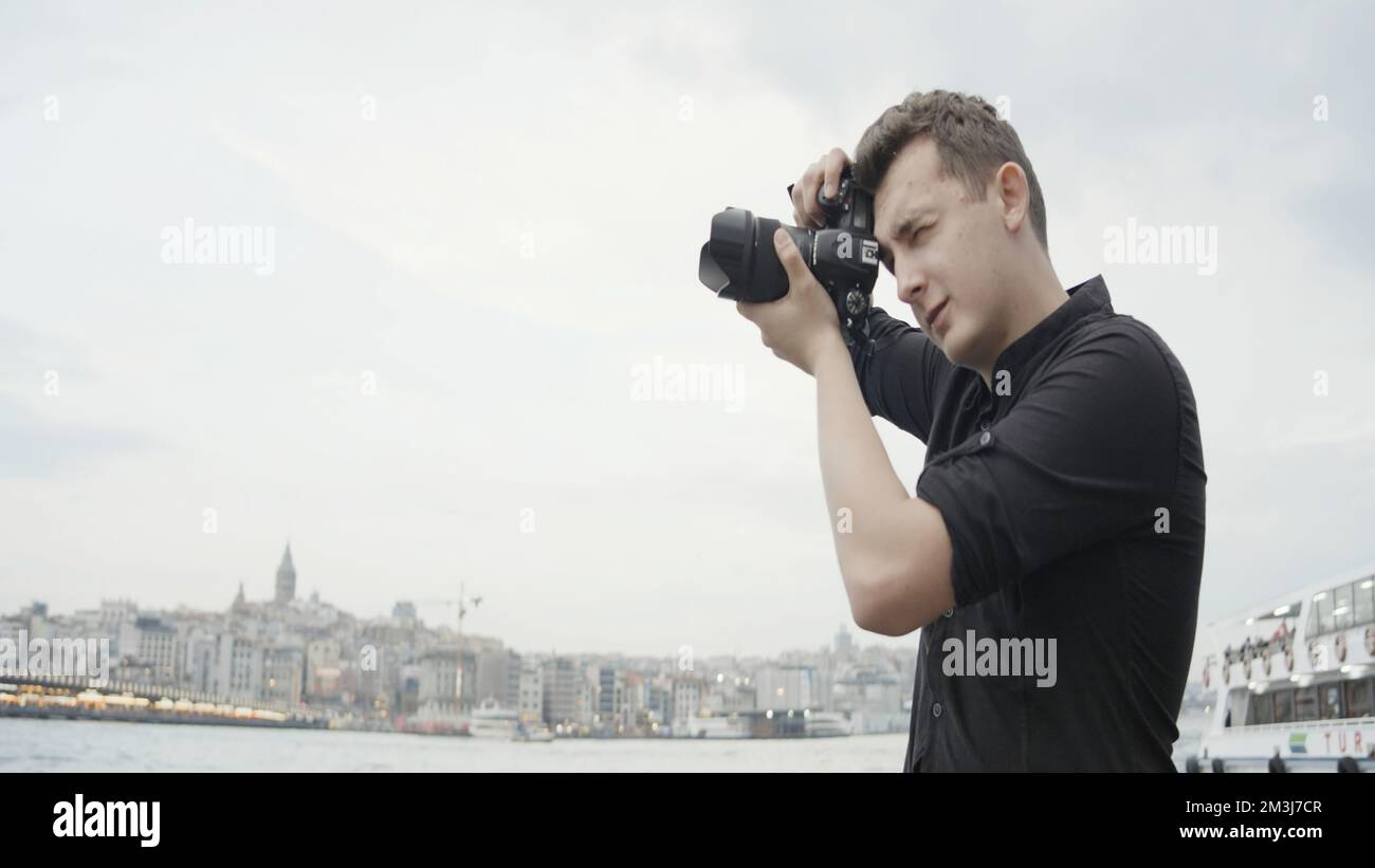 Photographer shoots architecture on camera. Action. Professional male ...