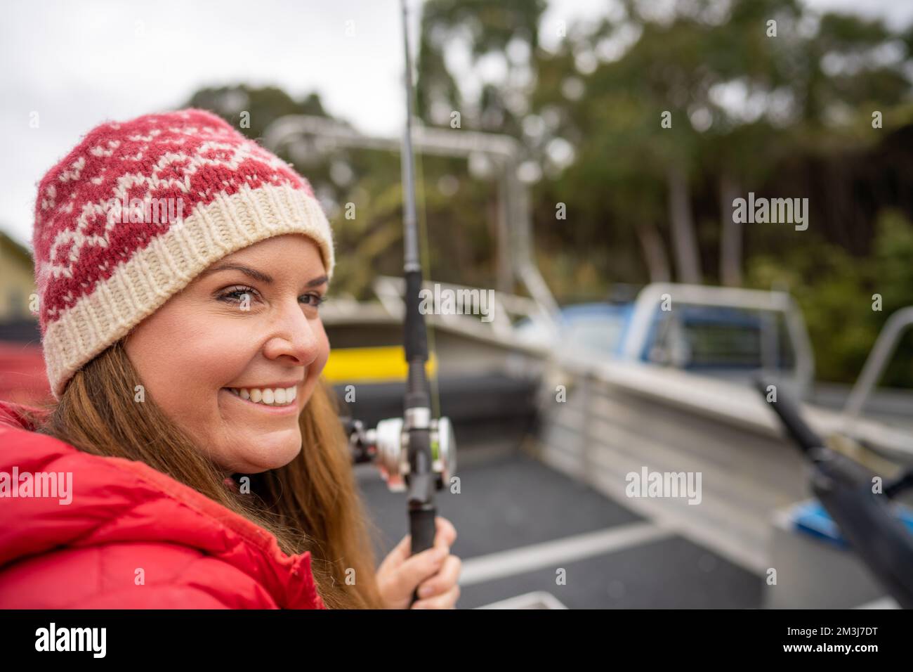 model girl fishing in a boat in summer in australia Stock Photo - Alamy