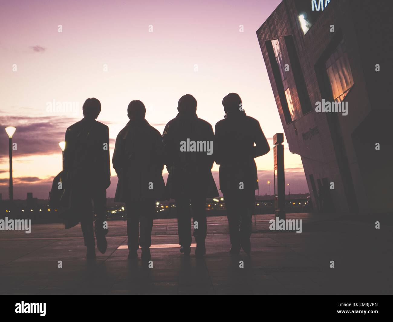 The Beatles Pier Head from behind with sunset, in Liverpool Stock Photo ...