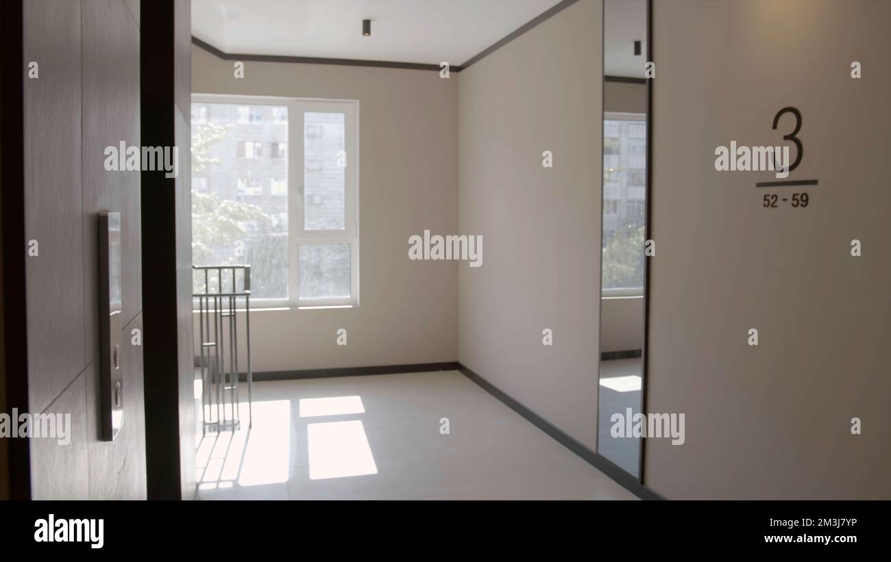 Modern entrance with white walls. Stock footage. Third floor of a ...