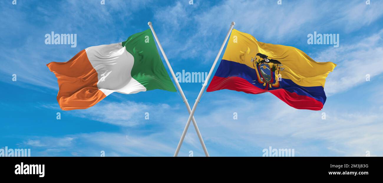 two crossed flags Ecuador and Ireland waving in wind at cloudy sky ...
