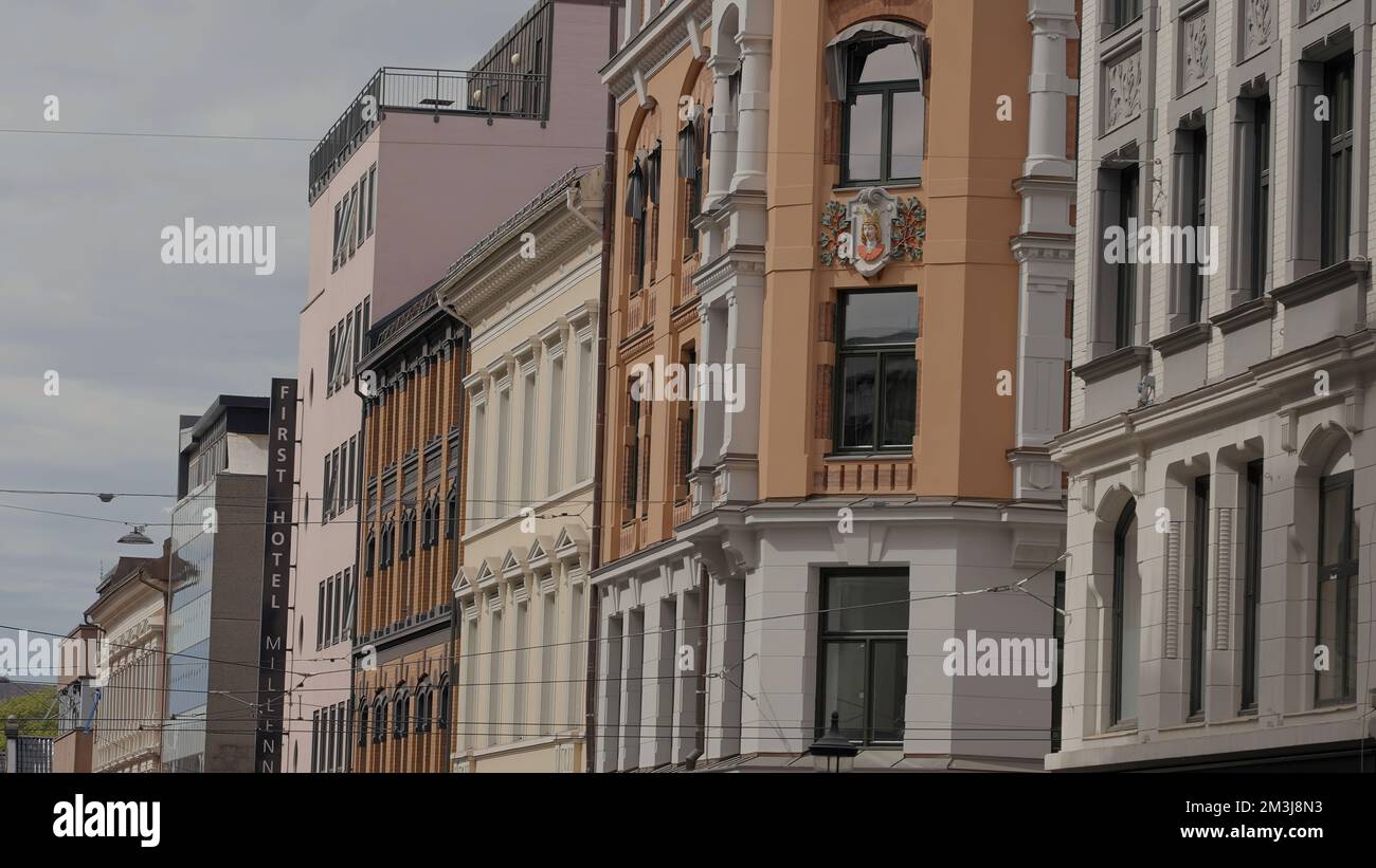 View of buildings facade with many windows. Action. City street with ...