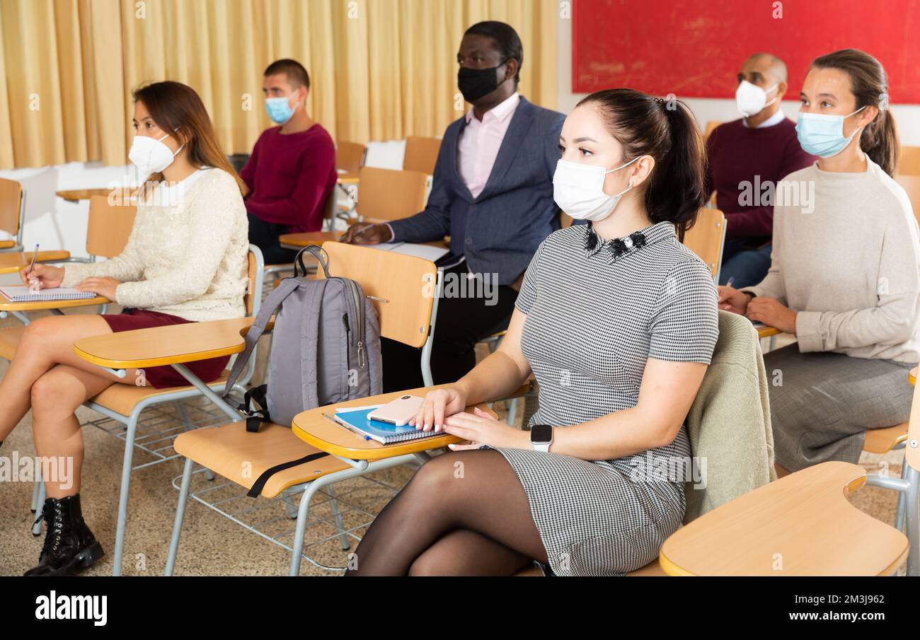 Adult students wearing masks for protect Covid-19 or corona virus ...