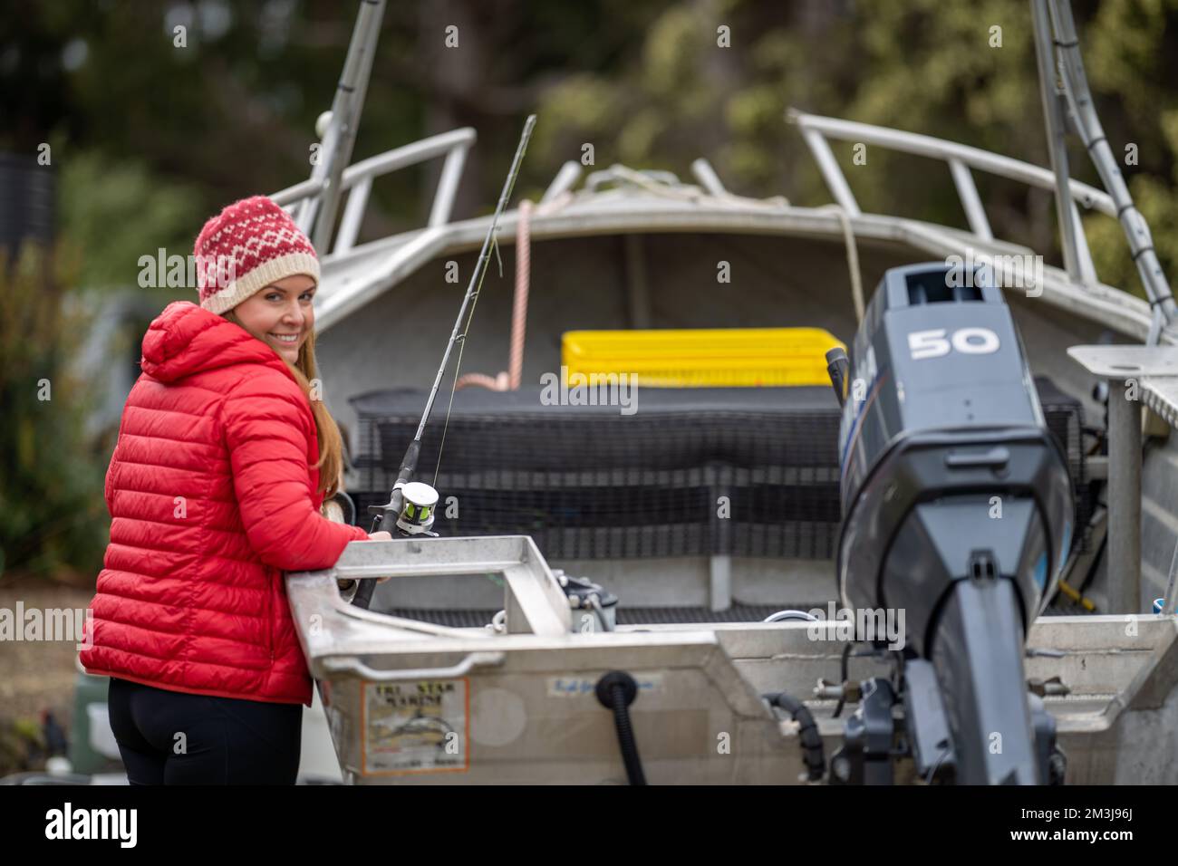 model girl fishing in a boat in summer in australia Stock Photo - Alamy