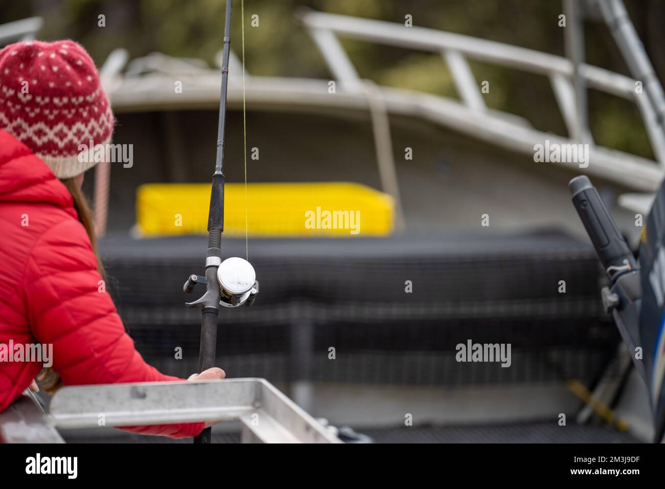 model girl fishing in a boat in summer in australia Stock Photo - Alamy