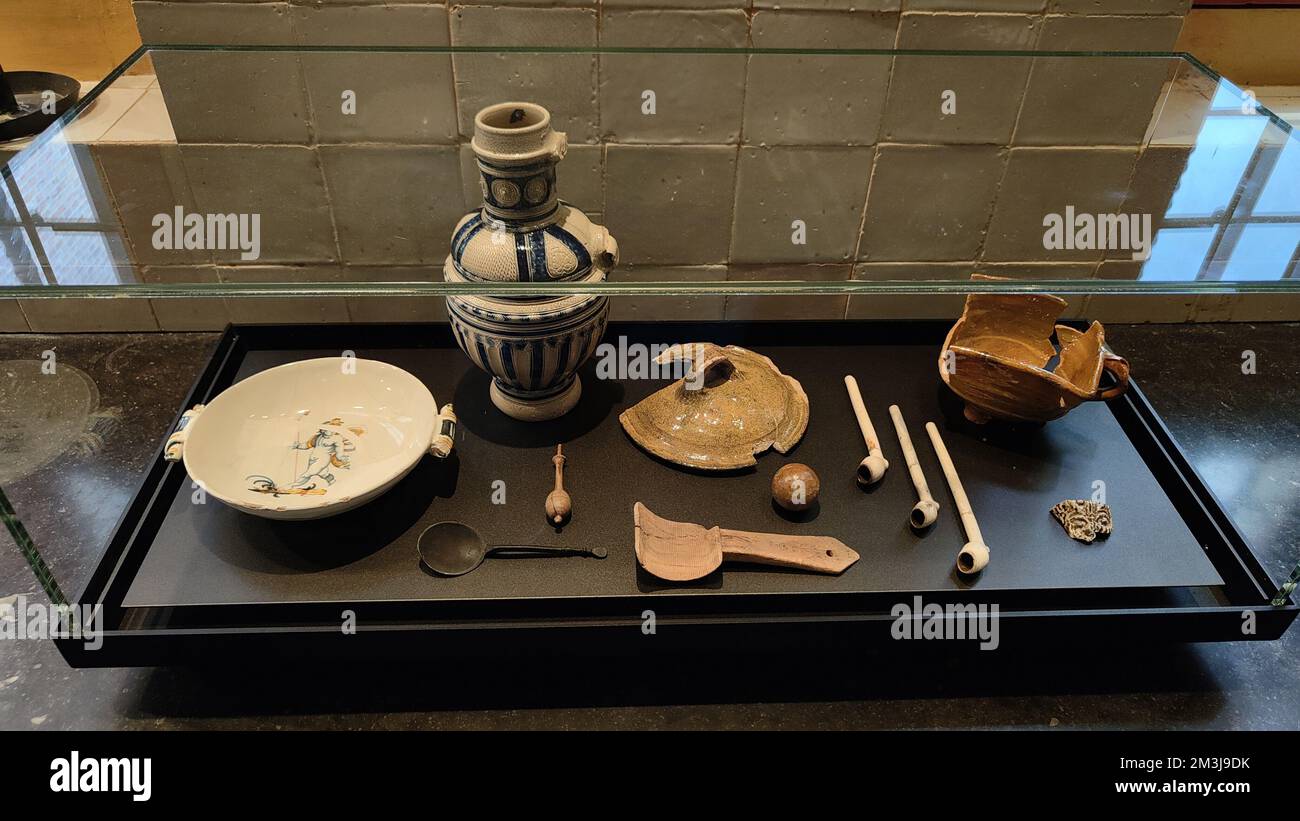 Old kitchen objects preserved in glass as findings Stock Photo - Alamy