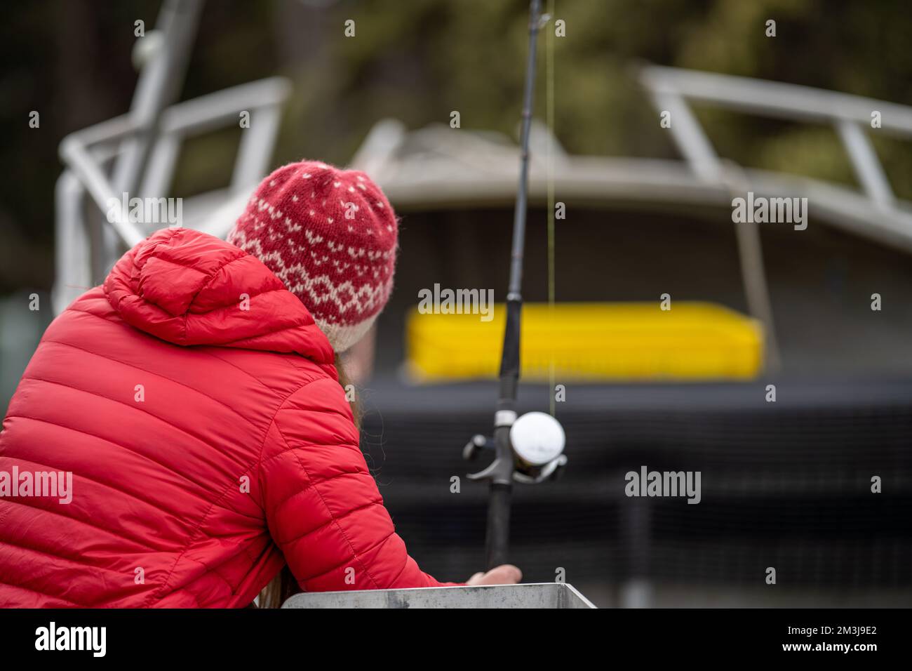 model girl fishing in a boat in summer in australia Stock Photo - Alamy