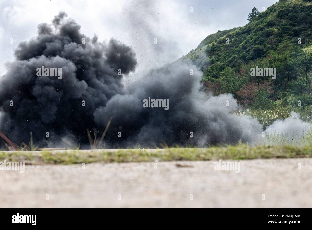 An improvised claymore mine is detonated during a field exercise at ...