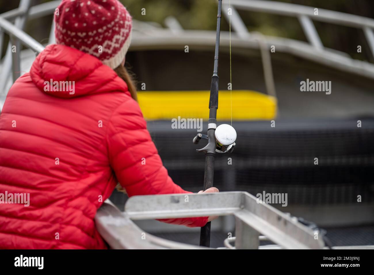 model girl fishing in a boat in summer in australia Stock Photo - Alamy