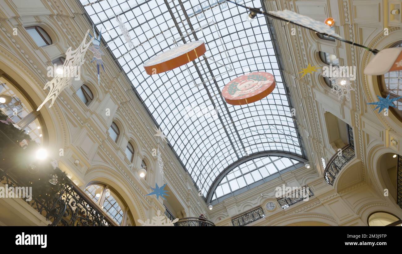 Department store with glass ceiling. Action. Decorated interior of a ...