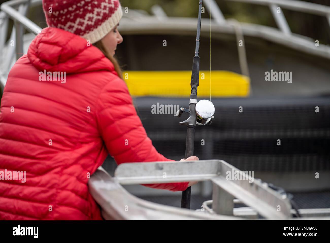 model girl fishing in a boat in summer in australia Stock Photo - Alamy