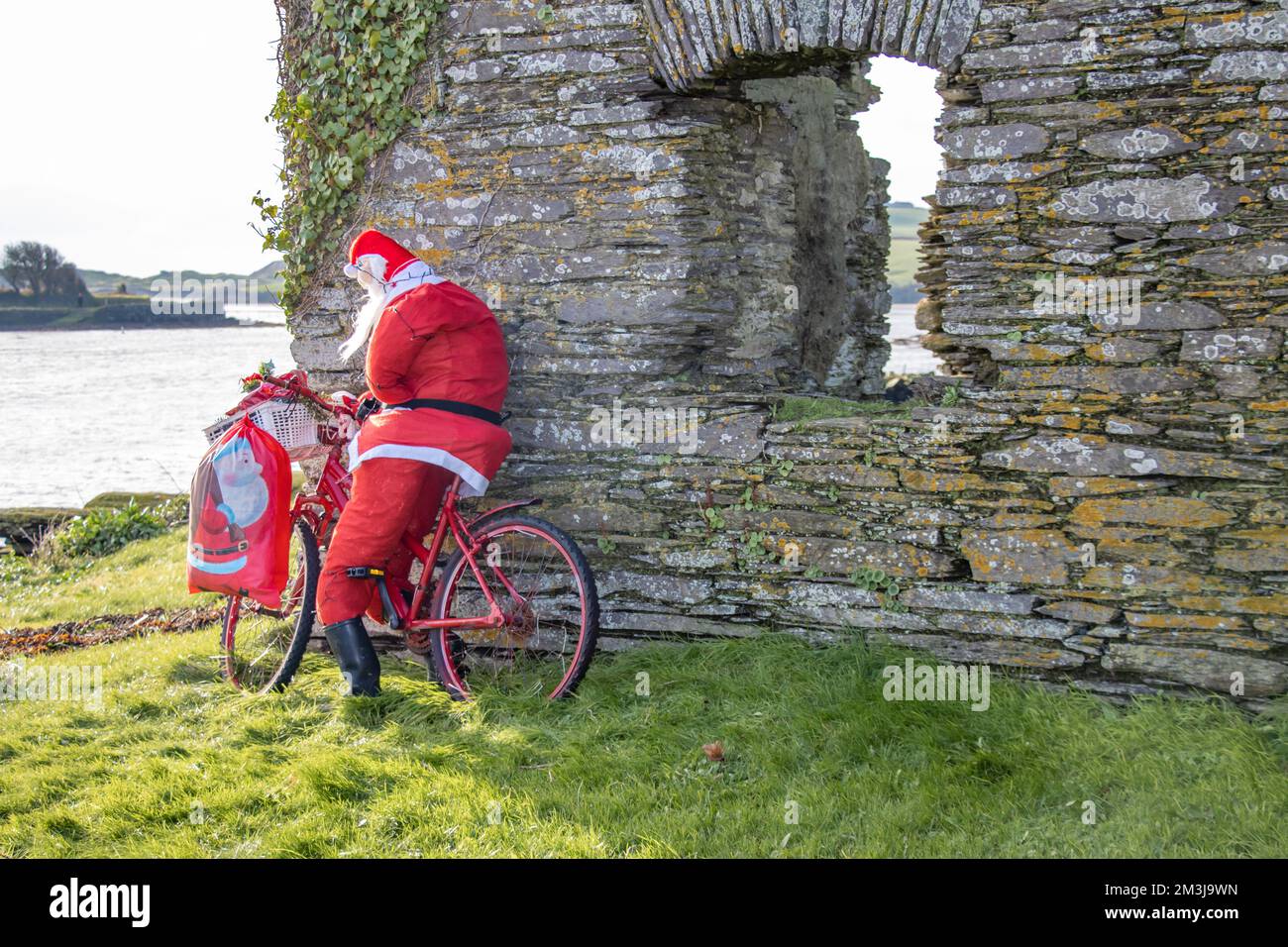 Santa on a bike, at Ring, Clonakilty, Co. Cork Dec 2022 Stock Photo - Alamy
