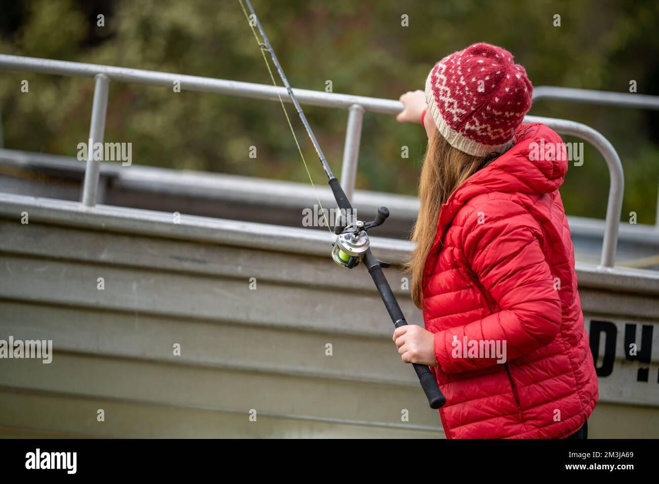 model girl fishing in a boat in summer in australia Stock Photo - Alamy