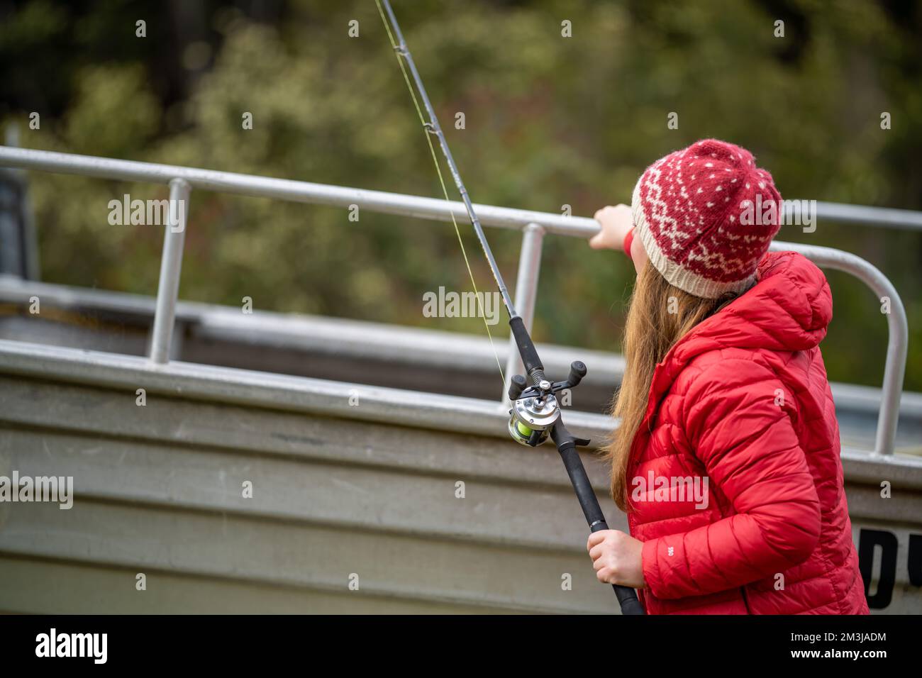 model girl fishing in a boat in summer in australia Stock Photo - Alamy