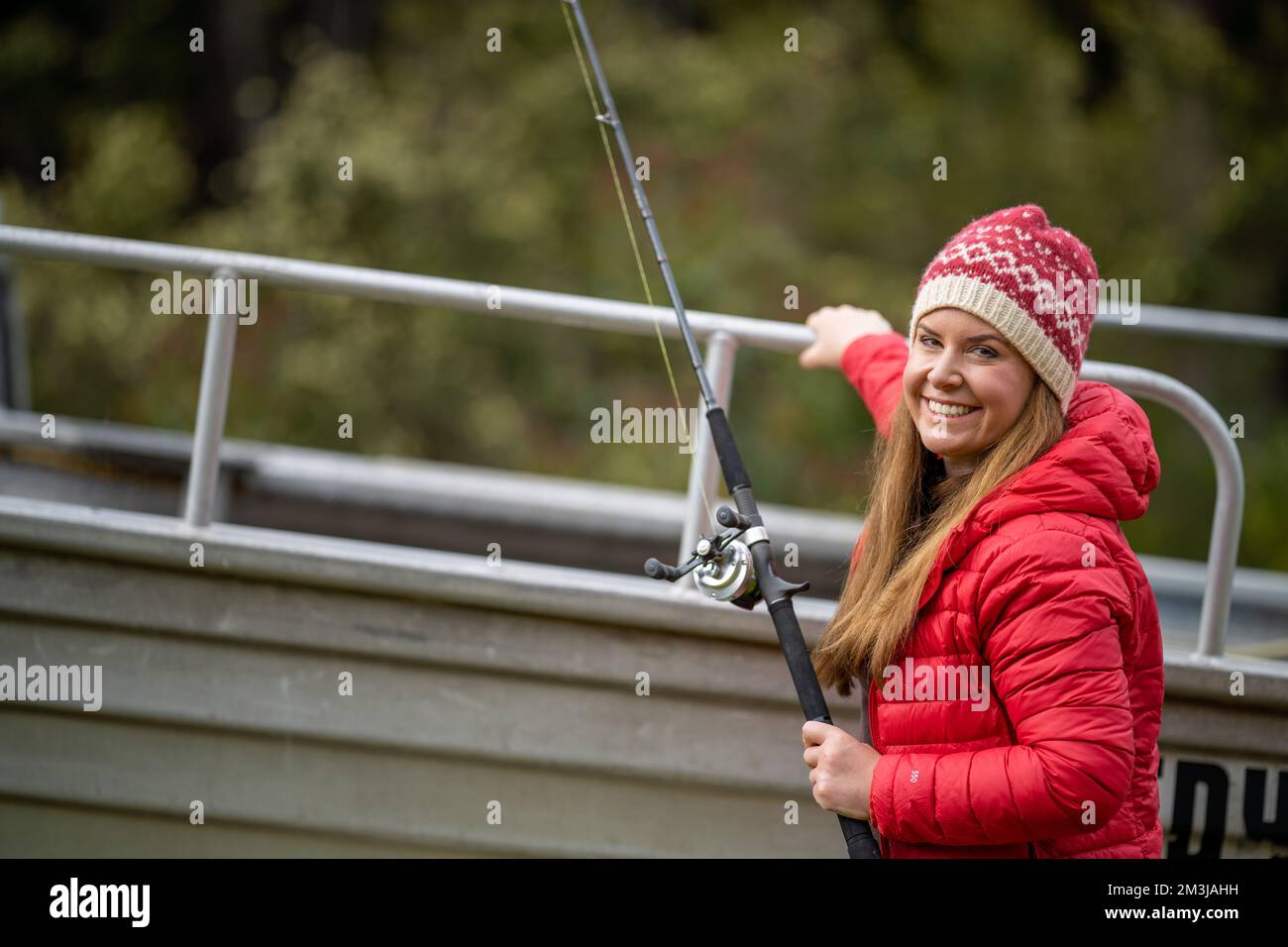 model girl fishing in a boat in summer in australia Stock Photo - Alamy