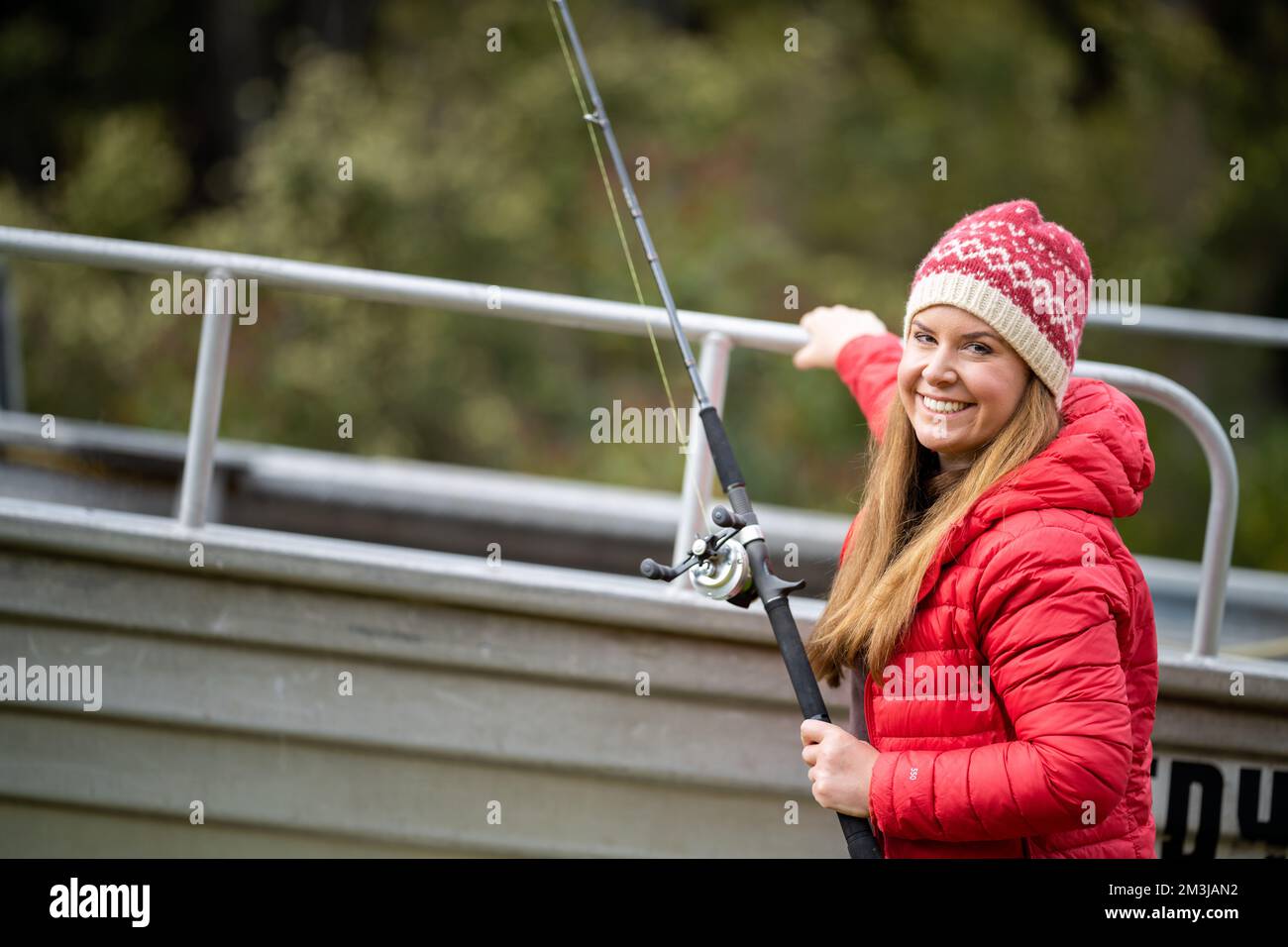 model girl fishing in a boat in summer in australia Stock Photo - Alamy