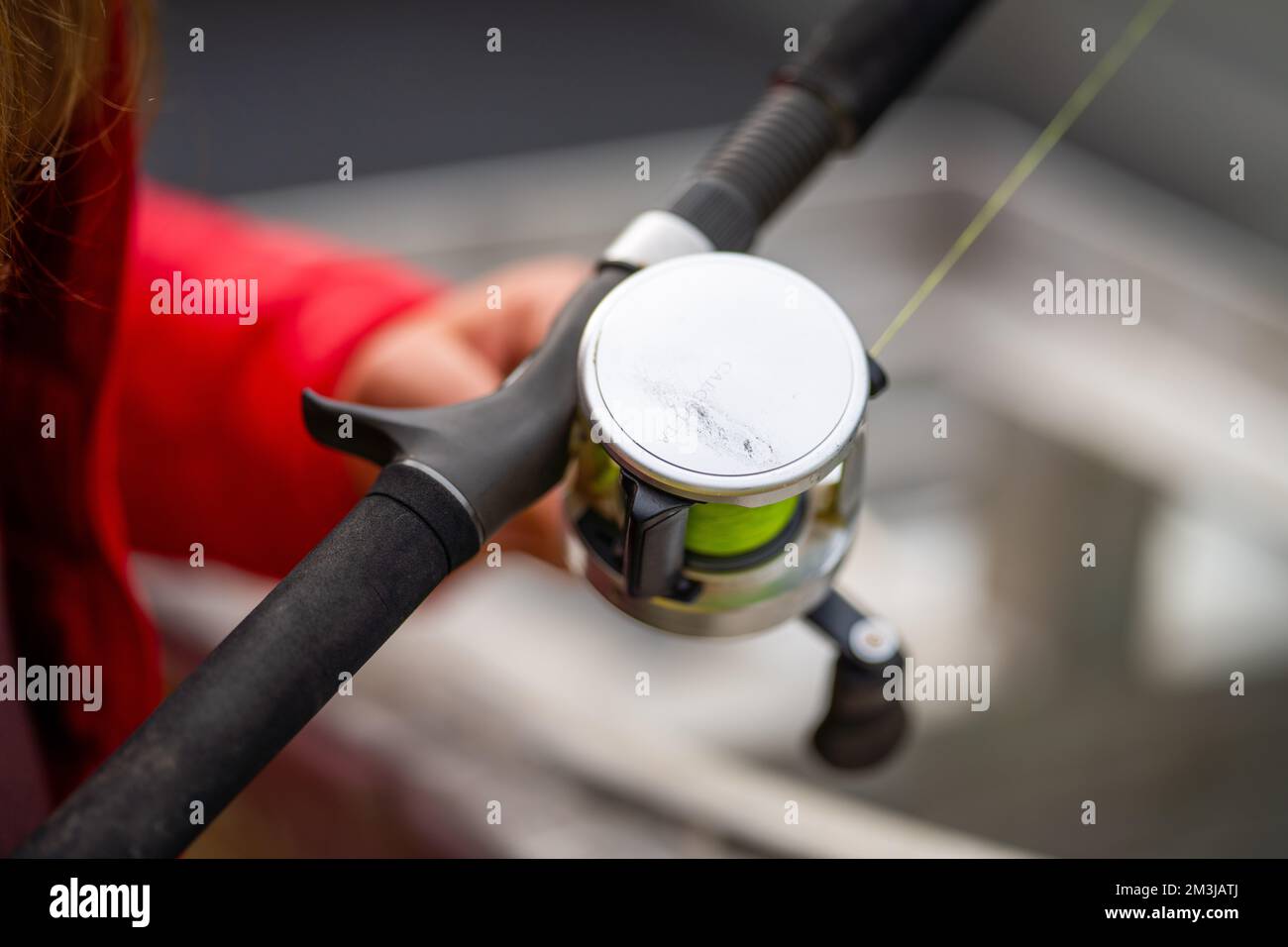 model girl fishing in a boat in summer in australia Stock Photo - Alamy
