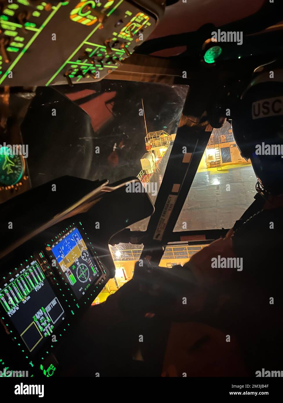 A Coast Guard Air Station Houston MH-65 Dolphin helicopter crew ...