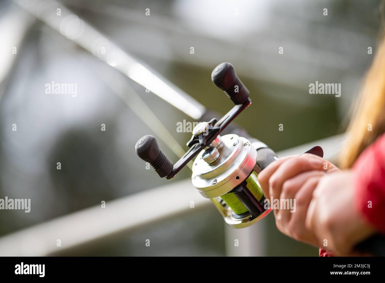 model girl fishing in a boat in summer in australia Stock Photo - Alamy