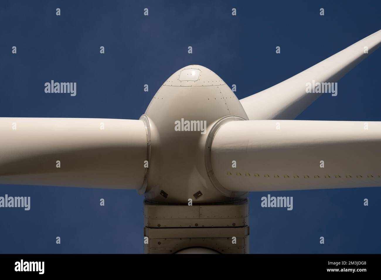 Close Up Shop of Modern Giant Wind Turbine Against Blue Sky Stock Photo ...