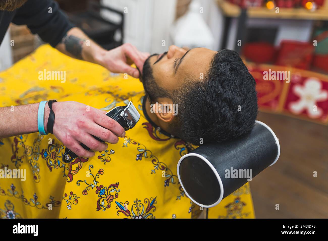 Back View Of Elegant Man Getting A Haircut And Beard Trim Barbershop