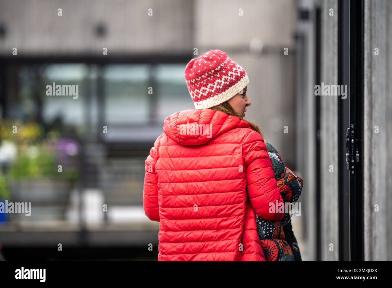 girl walking away from the camera in winer wearing a jacket in new york ...
