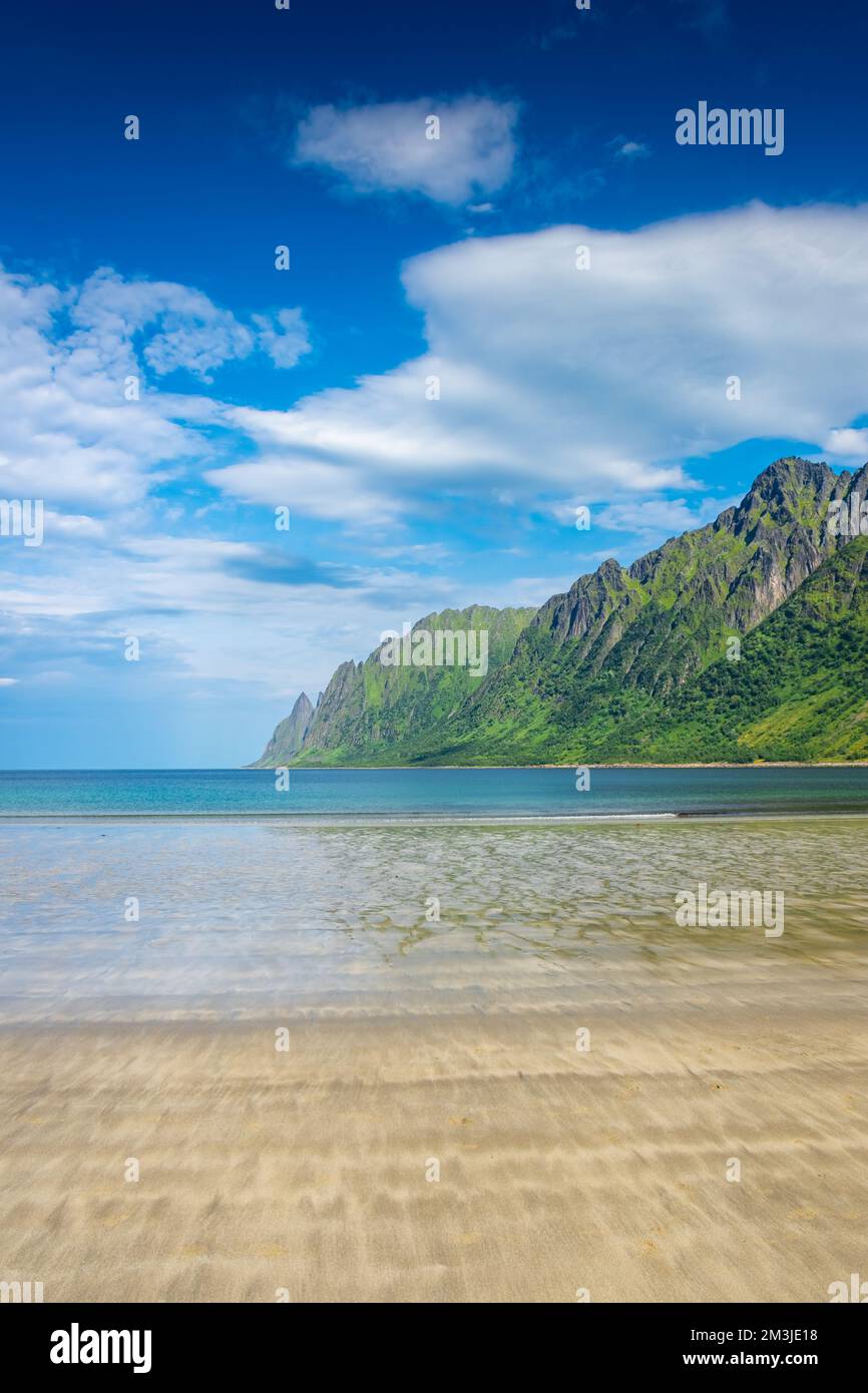The crystal clear water of the Ersfjordstranda beach in Senja Island ...