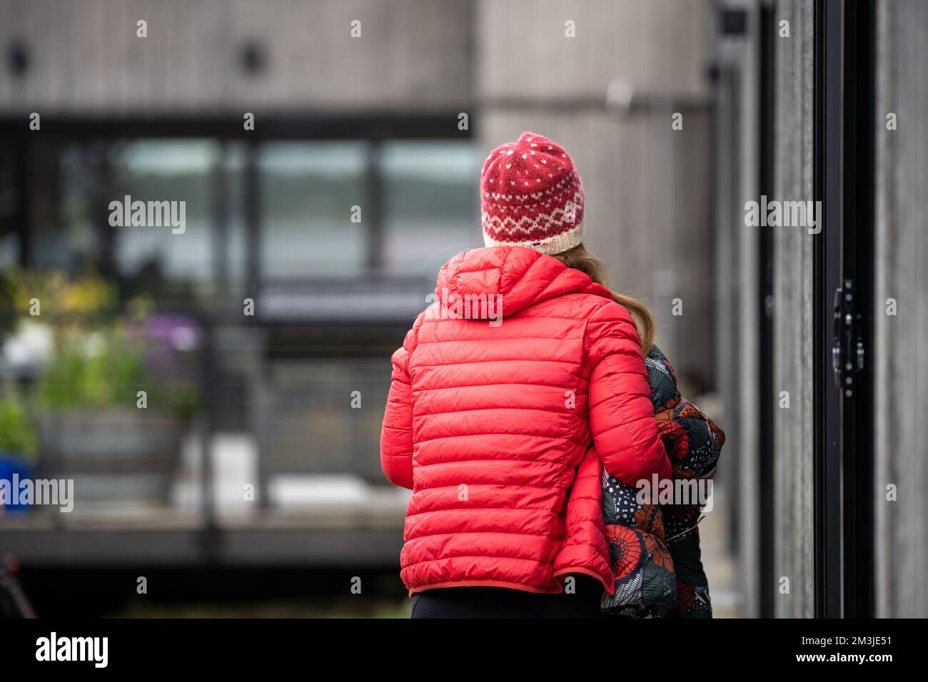 girl walking away from the camera in winer wearing a jacket in new york ...