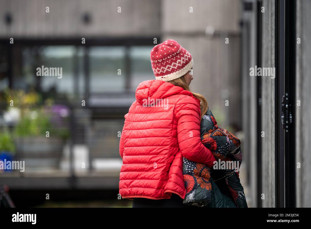 girl walking away from the camera in winer wearing a jacket in new york ...