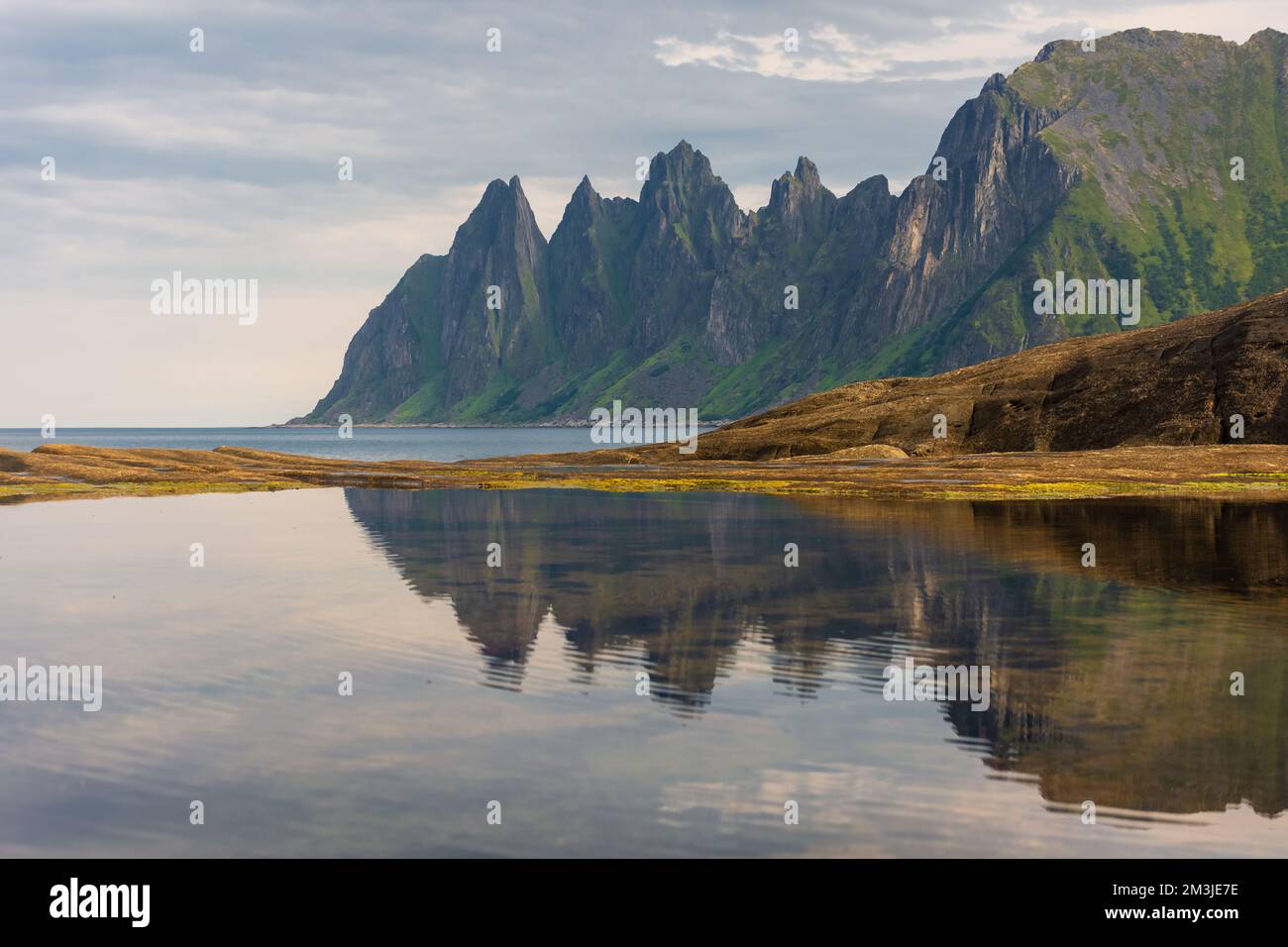 The Tungeneset (Devil's Teeth), mountains over the ocean in Senja ...