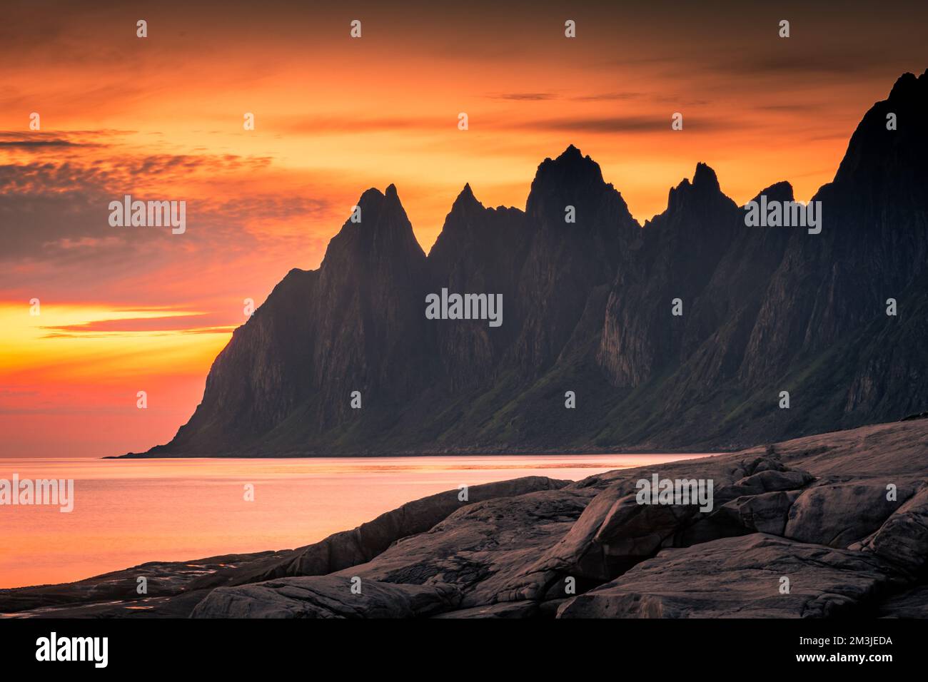 Stunning midnight sun over the Tungeneset (Devil's Teeth) in Senja ...