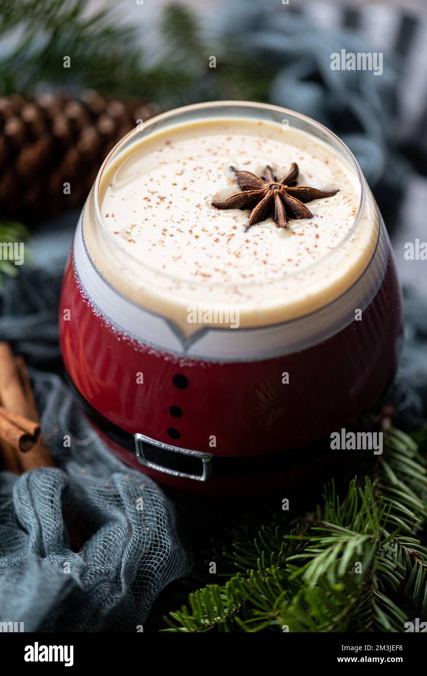 Eggnog in a santa cup for dessert Stock Photo - Alamy