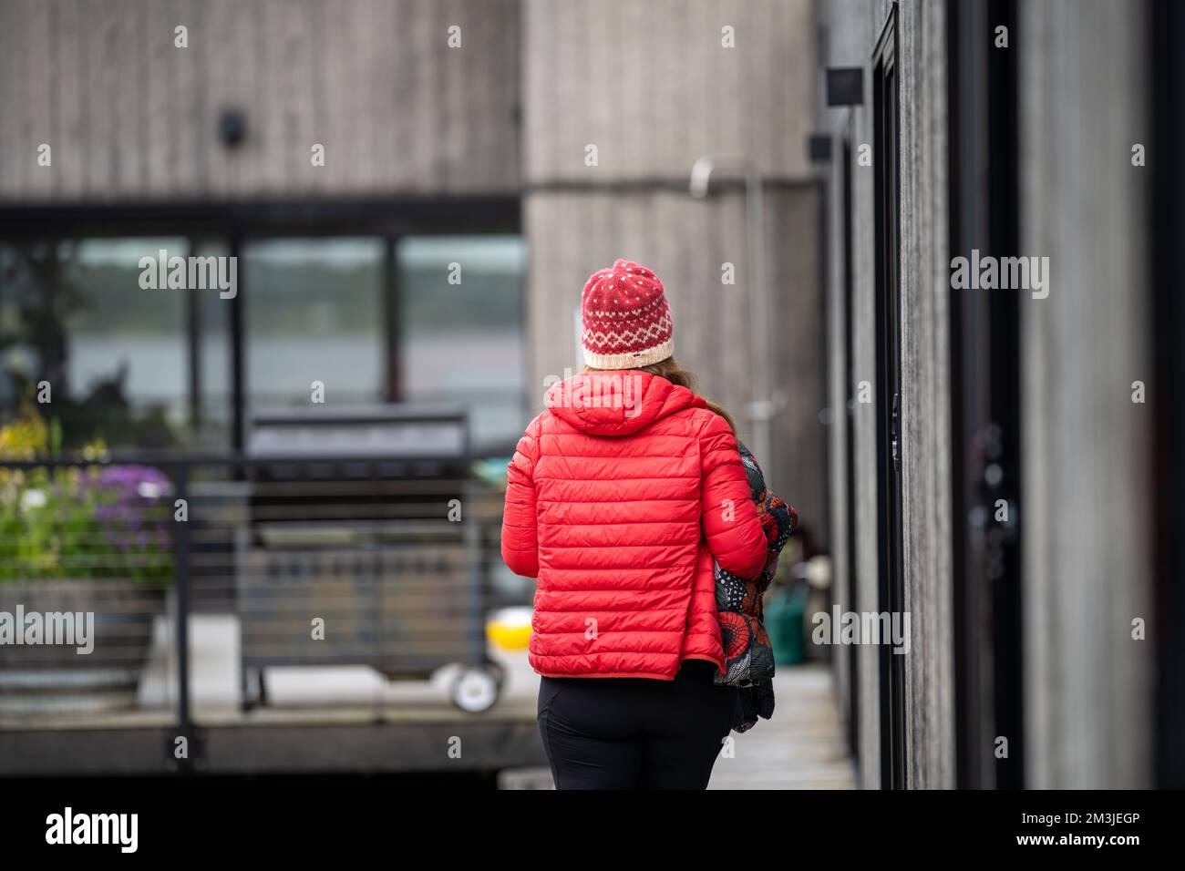 girl walking away from the camera in winer wearing a jacket in new york ...