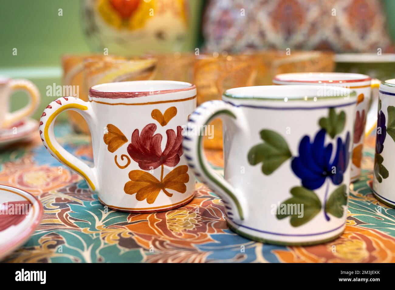 White ceramic plates on a shelf in a store. Designer ceramic plates ...