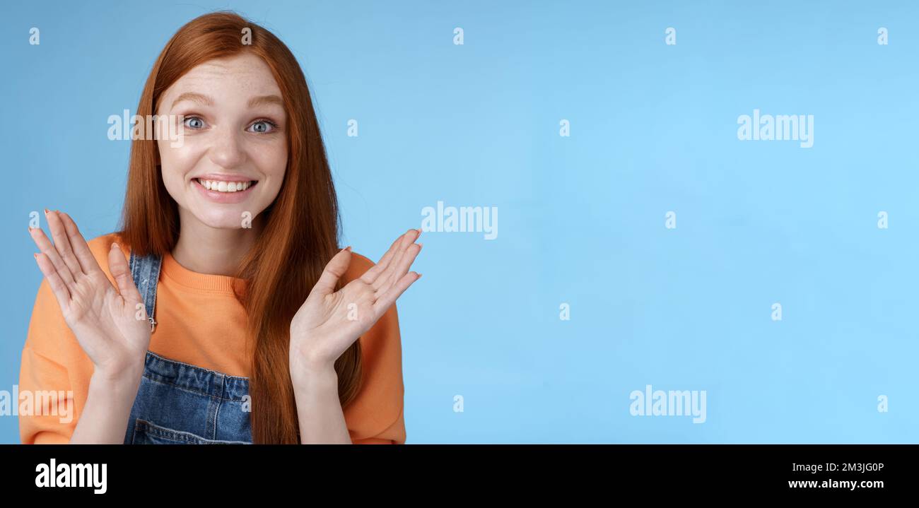 Proud happy supportive young redhead girl friend clapping hands gladly ...