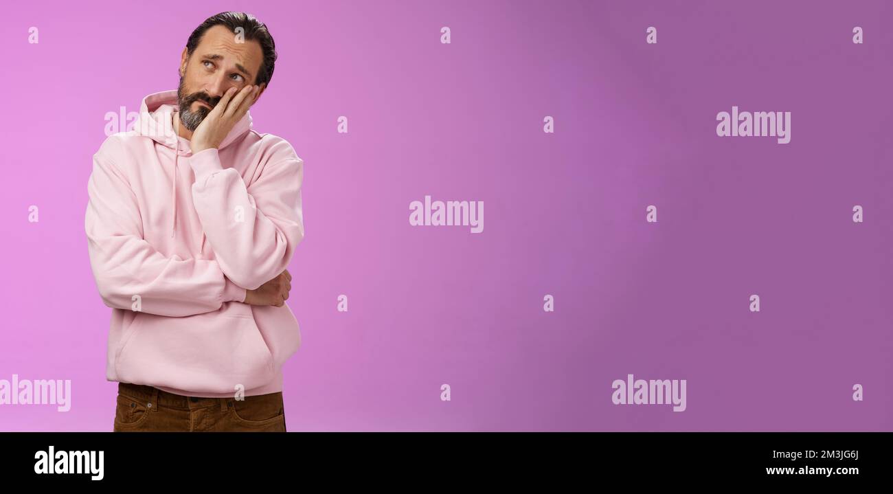 Sad gloomy bearded mature man lean head palm frowning look upper left ...