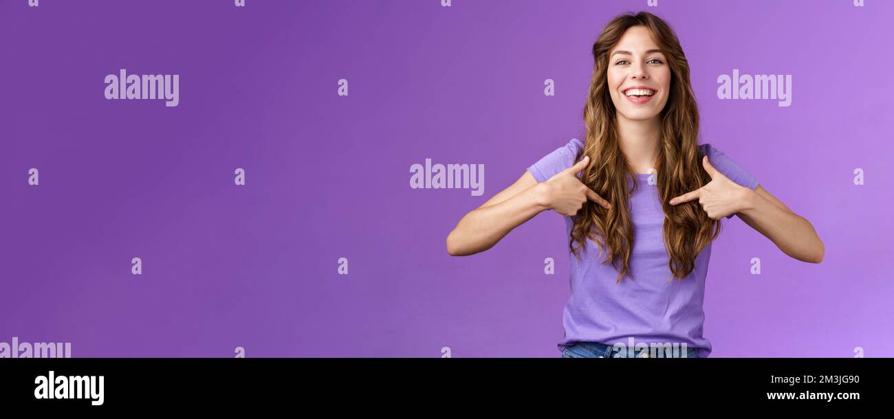 Boastful good-looking curly european female pointing herself proud who ...