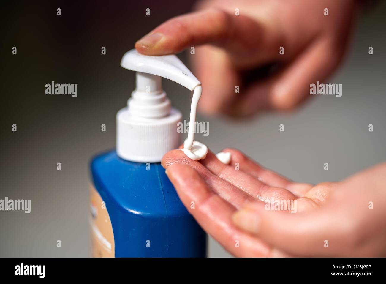 girl applying sunscreen in australia in summer on a deck Stock Photo ...