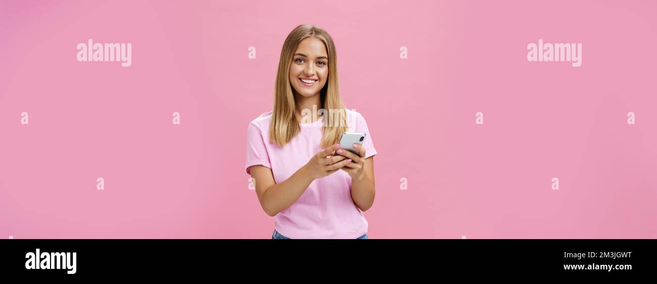 Woman calling taxy via smartphone asking friend address smiling ...