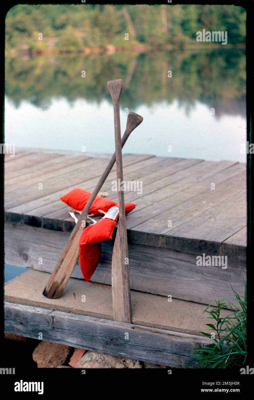 Oars and life vest on dock , Rowing, Life preservers. Edmund L ...