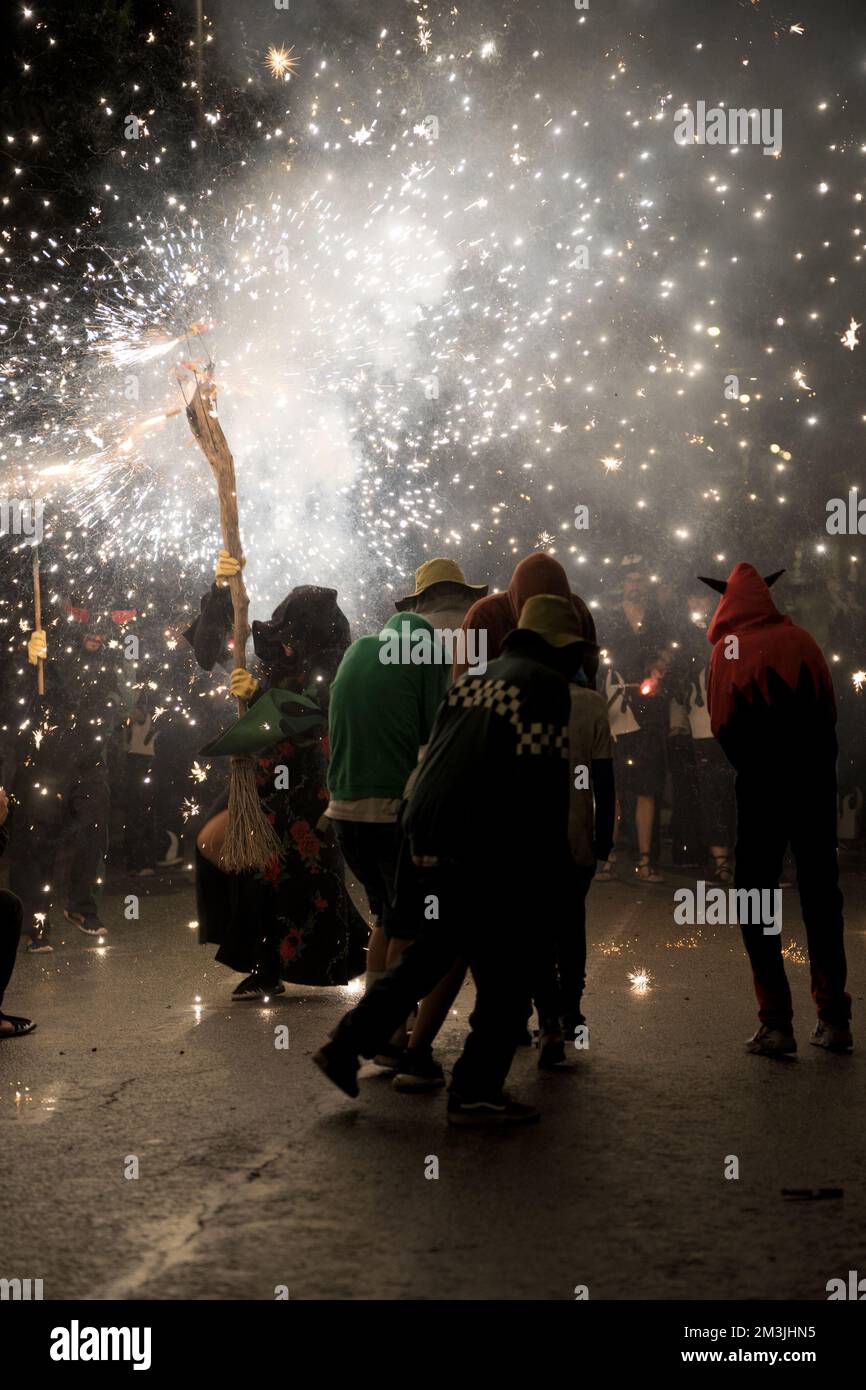 Some people dancing dressed as devil carrying fireworks in Catalonia ...