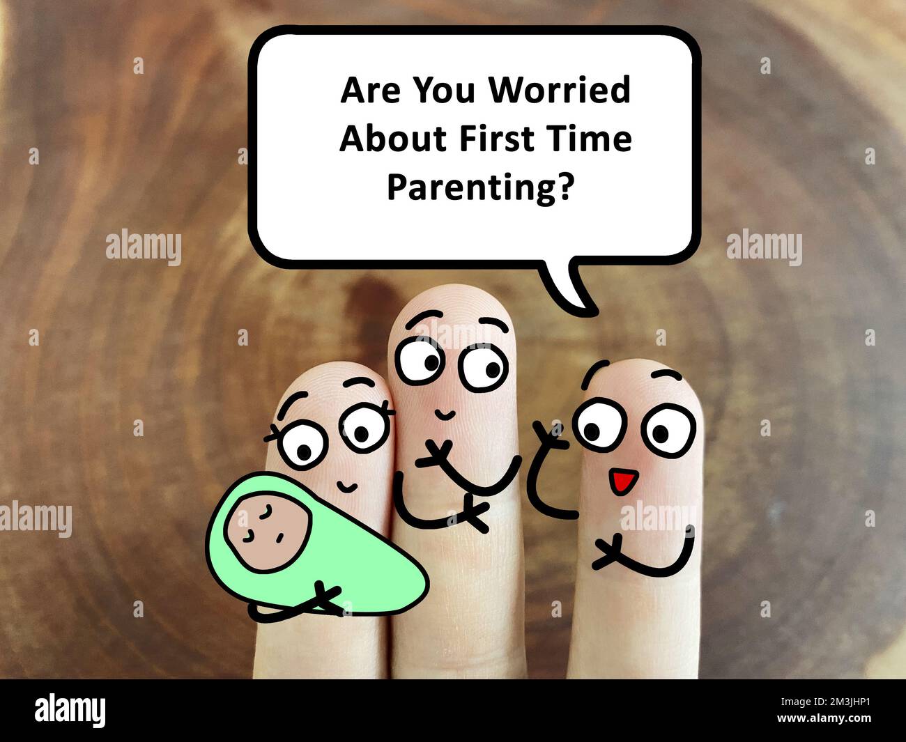 Three fingers are decorated as three person. One of them is holding a ...