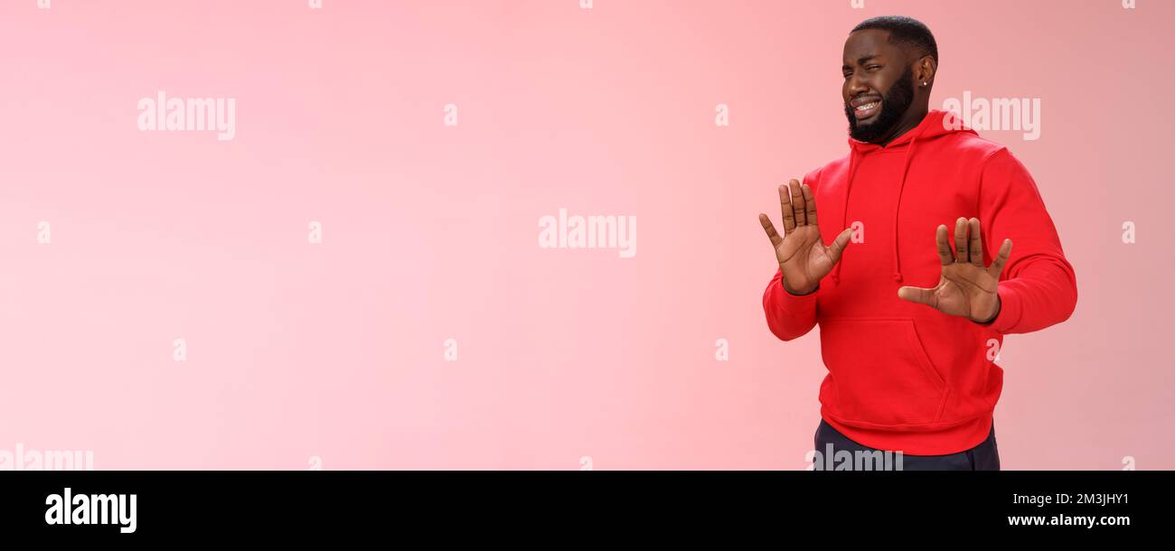 Awkward african american guy step back cringing dislike unwilling go ...