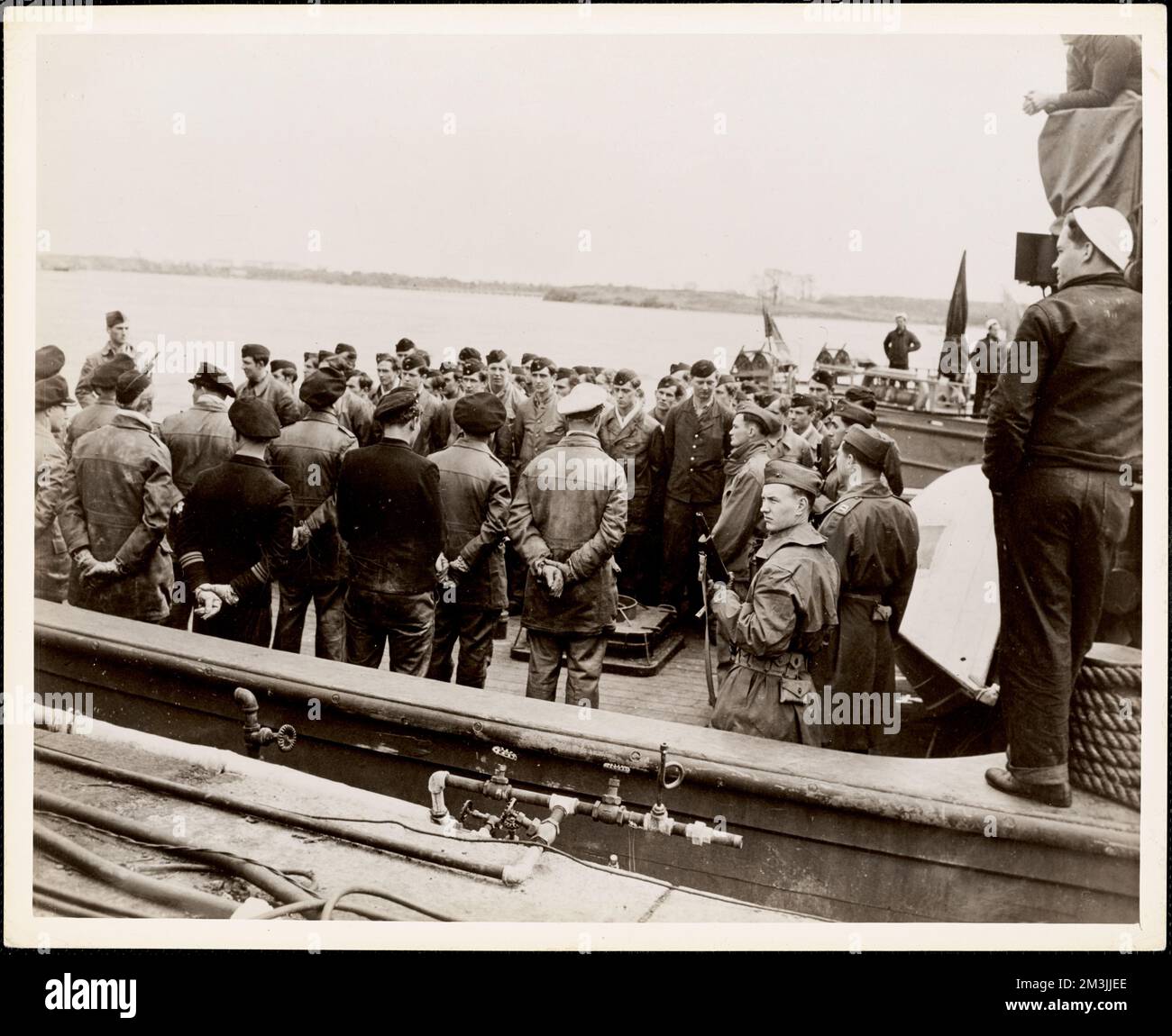 Officers and Crew on deck of tug which brought in surrendered sub U-873 ...