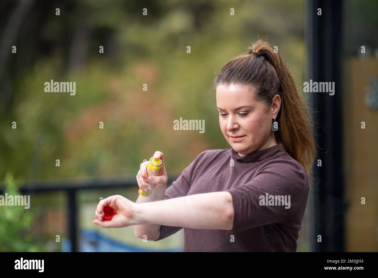 Woman child spray skin hi-res stock photography and images - Alamy