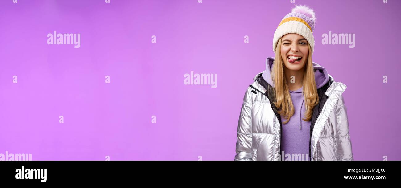 Cheeky carefree delighted charming blond girl having fun feel amused ...