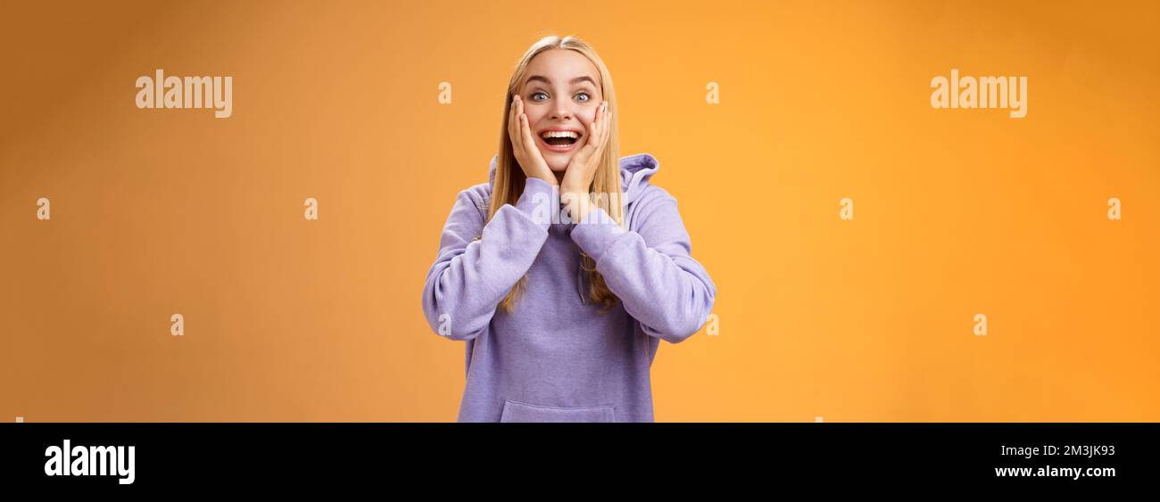 Surprised happy astonished fair-haired girlfriend receive incredible ...