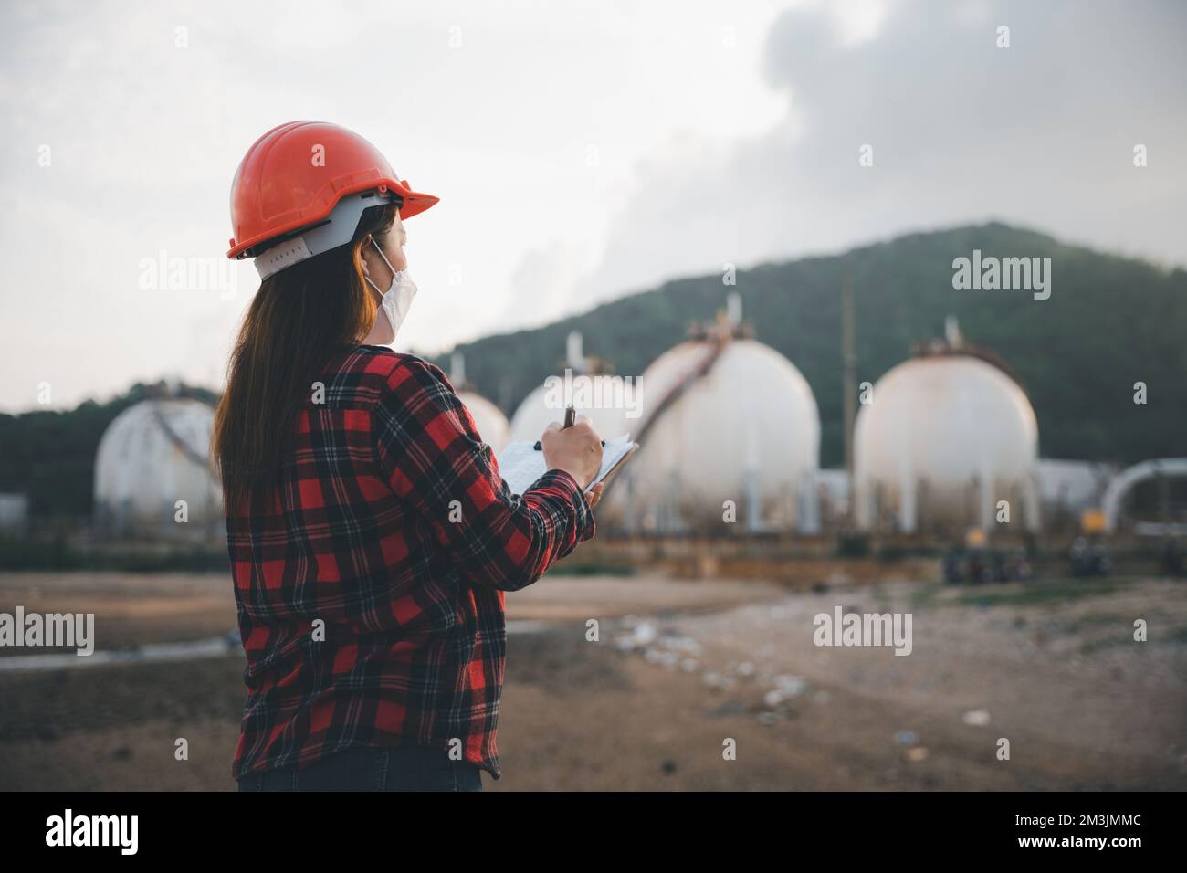 Happy Asian worker woman in oil chemical industry working visual ...