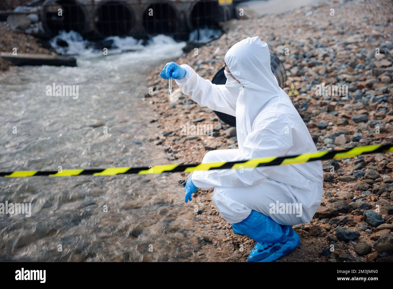 Ecologist sampling water from the river with test tube Stock Photo - Alamy