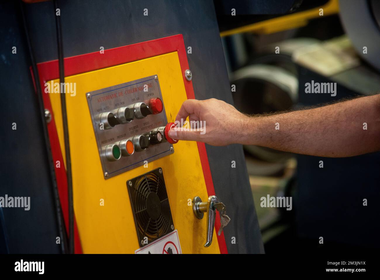 Professional worker pressing buttons on machine control board Stock ...